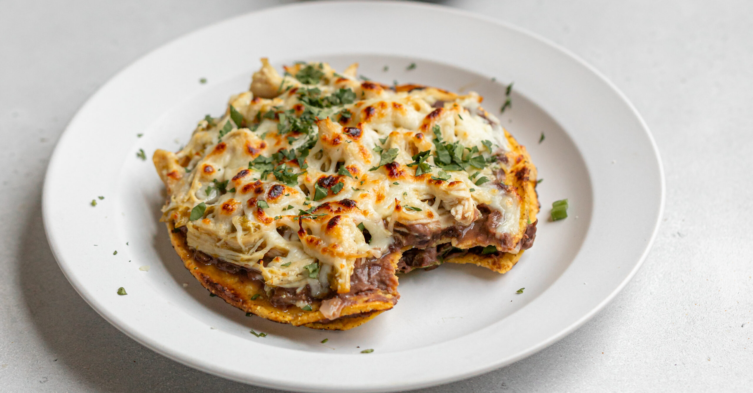 Shredded Chicken Tostada Stacks with Refried Black Beans - A Flavor Journal